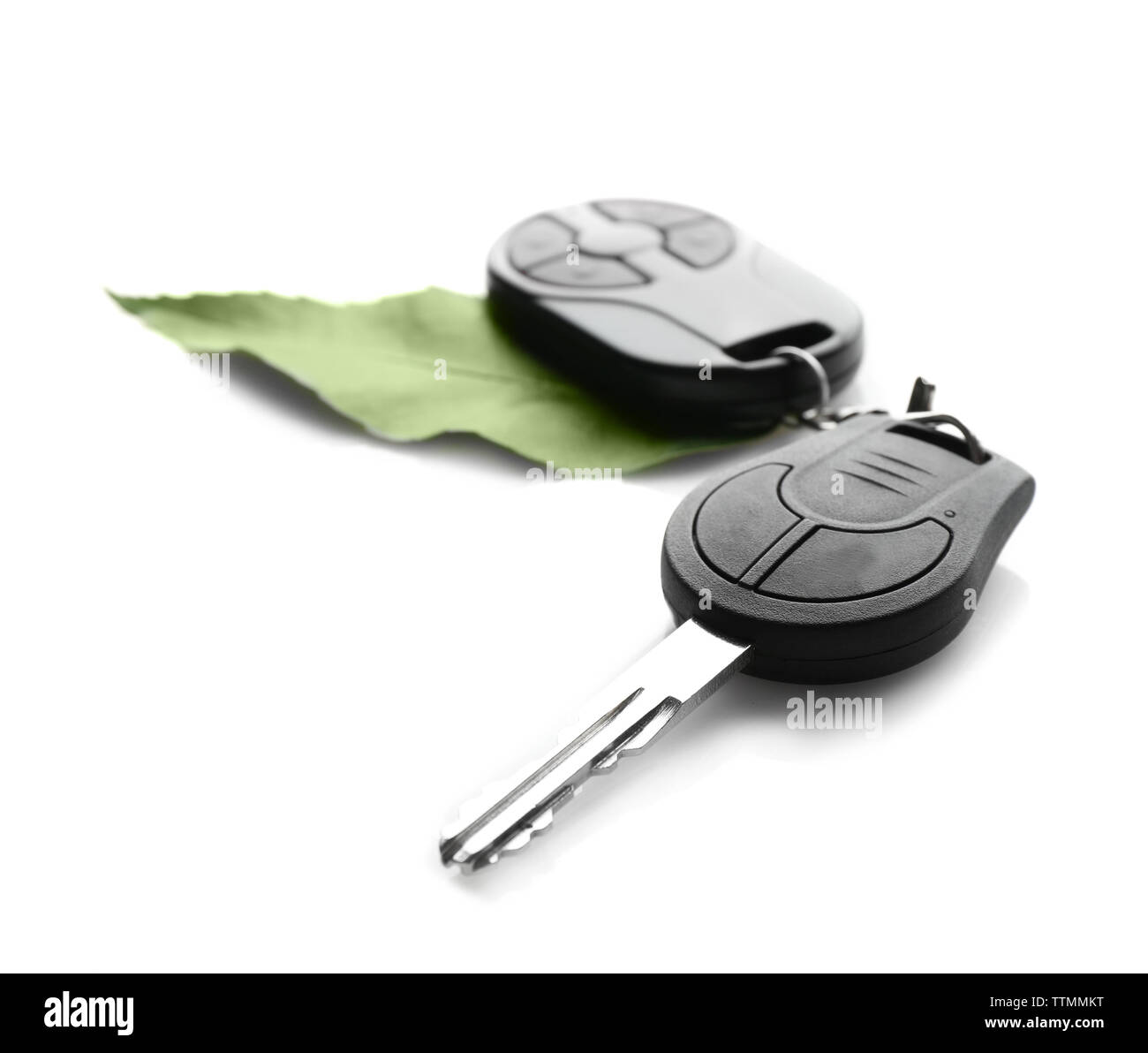 Car key with green leaf, isolated on white Stock Photo - Alamy