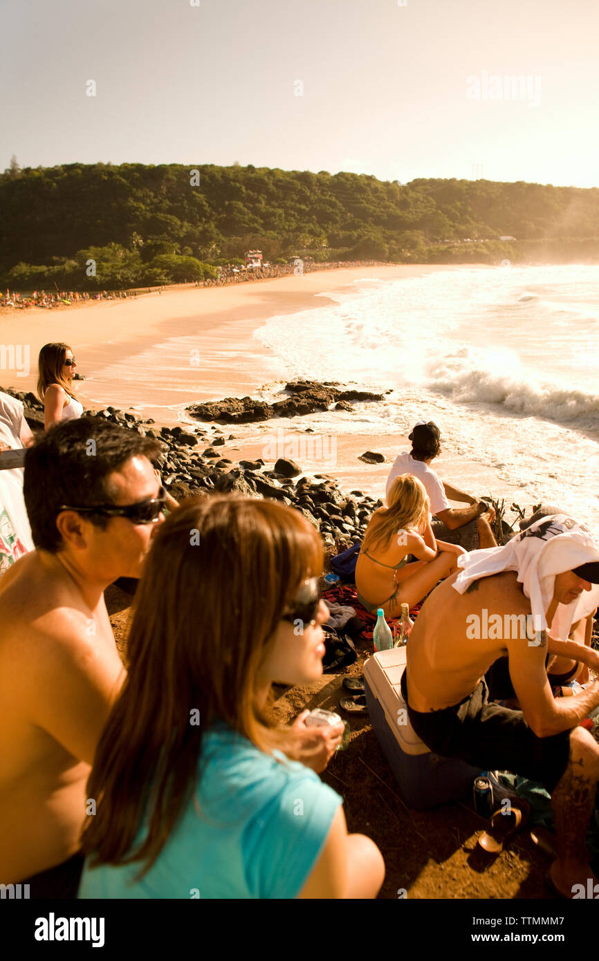 USA, Hawaii, Oahu, large crowd of people watch the Eddie Aikau surfing ...