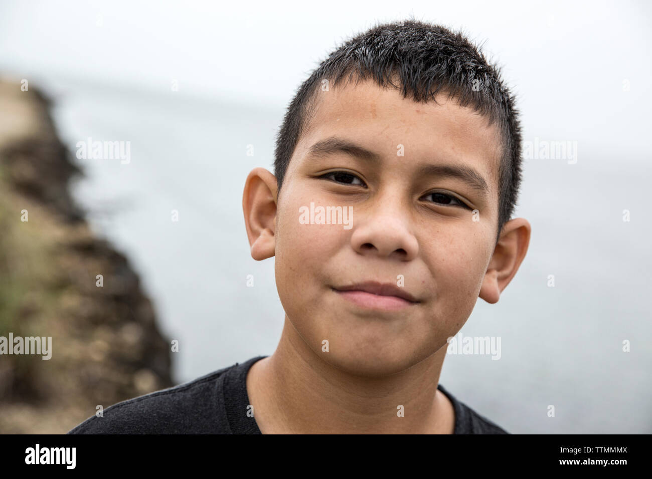 USA, Oahu, a young boy at the Kaneohe fish pond, the son of Keith Chang ...
