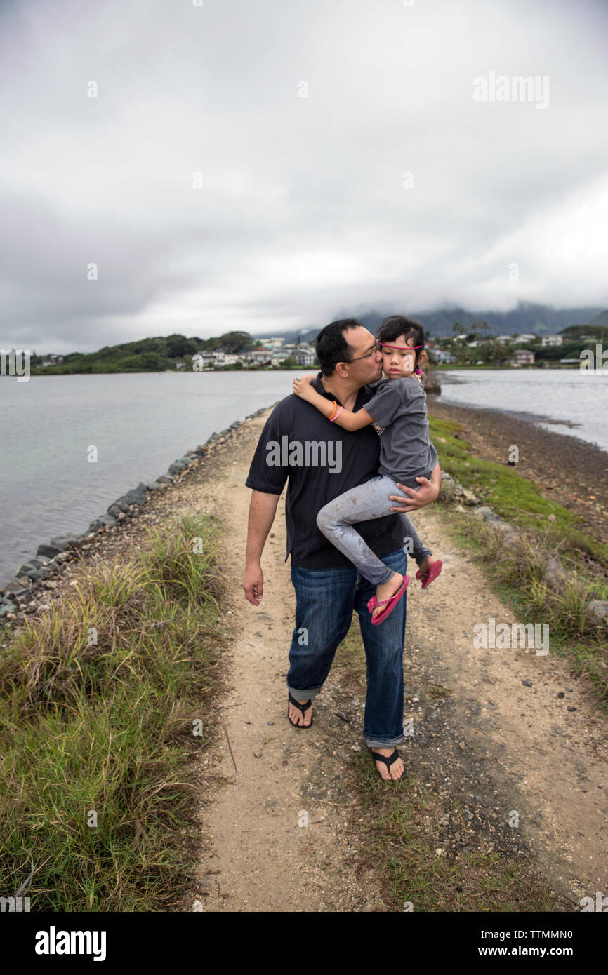 USA, Oahu, Hawaii, Jujitsu martial arts fighter Keith Chang with his ...