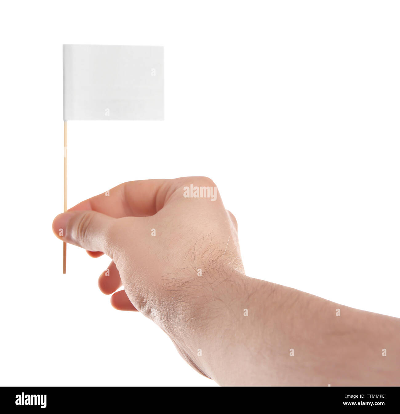 Man hand holding white flag, isolated on white Stock Photo - Alamy