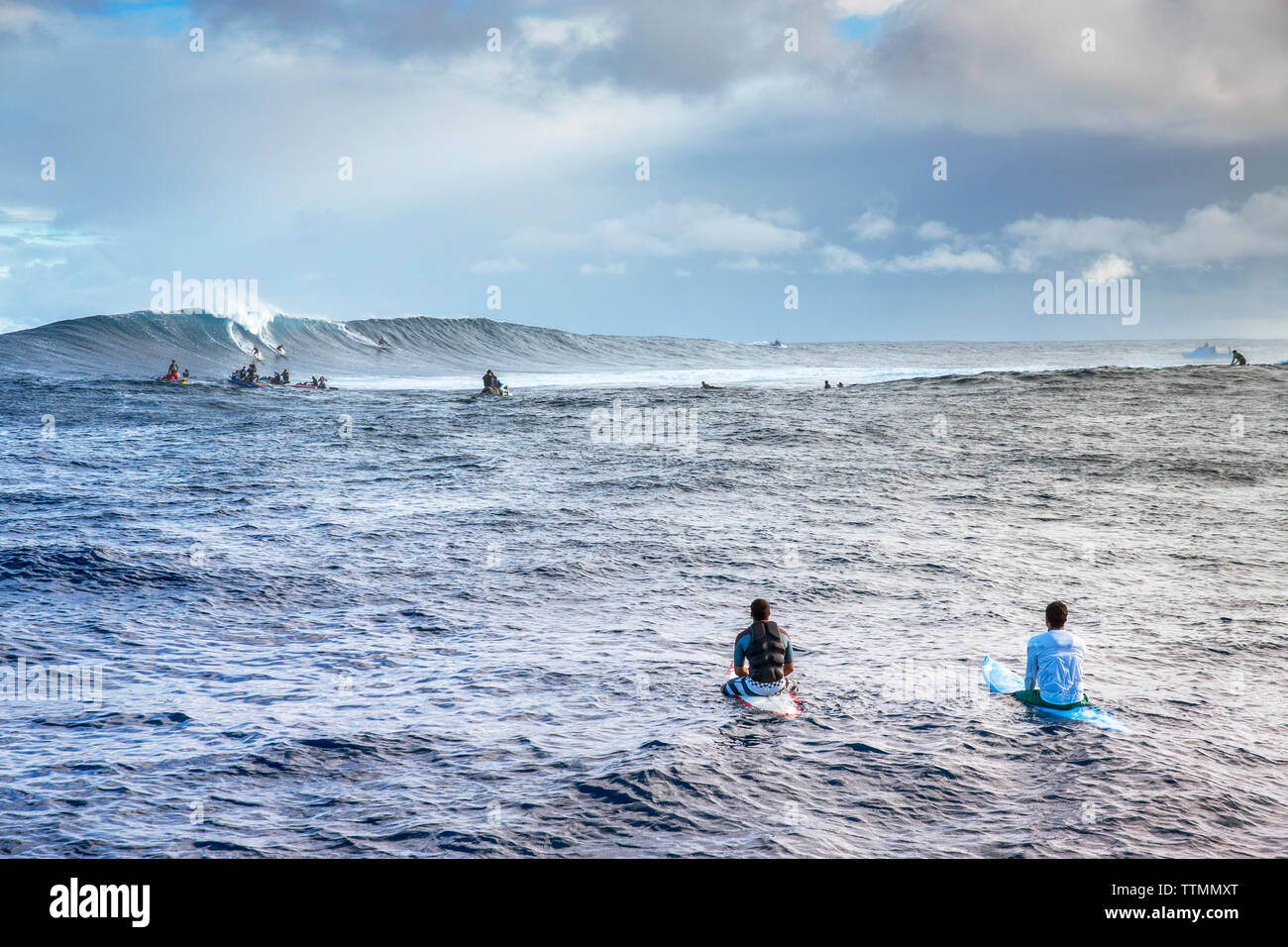 USA, HAWAII, Maui, Jaws, surfers and boats in the water at Peahi on the ...
