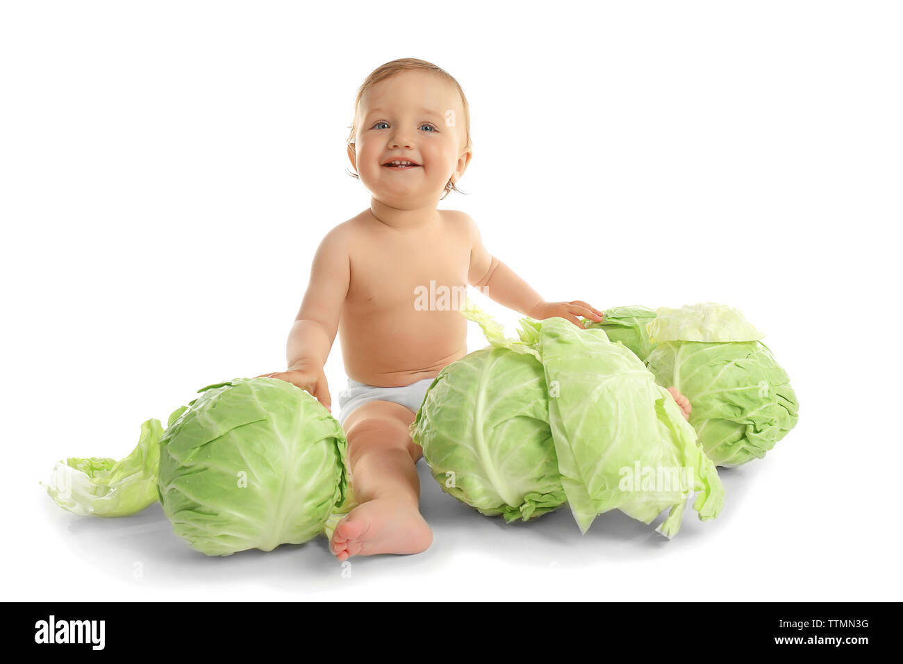 Cute baby girl with cabbage, isolated on white Stock Photo - Alamy