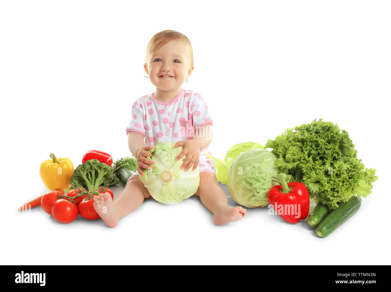 Cute baby girl with vegetables, isolated on white Stock Photo - Alamy
