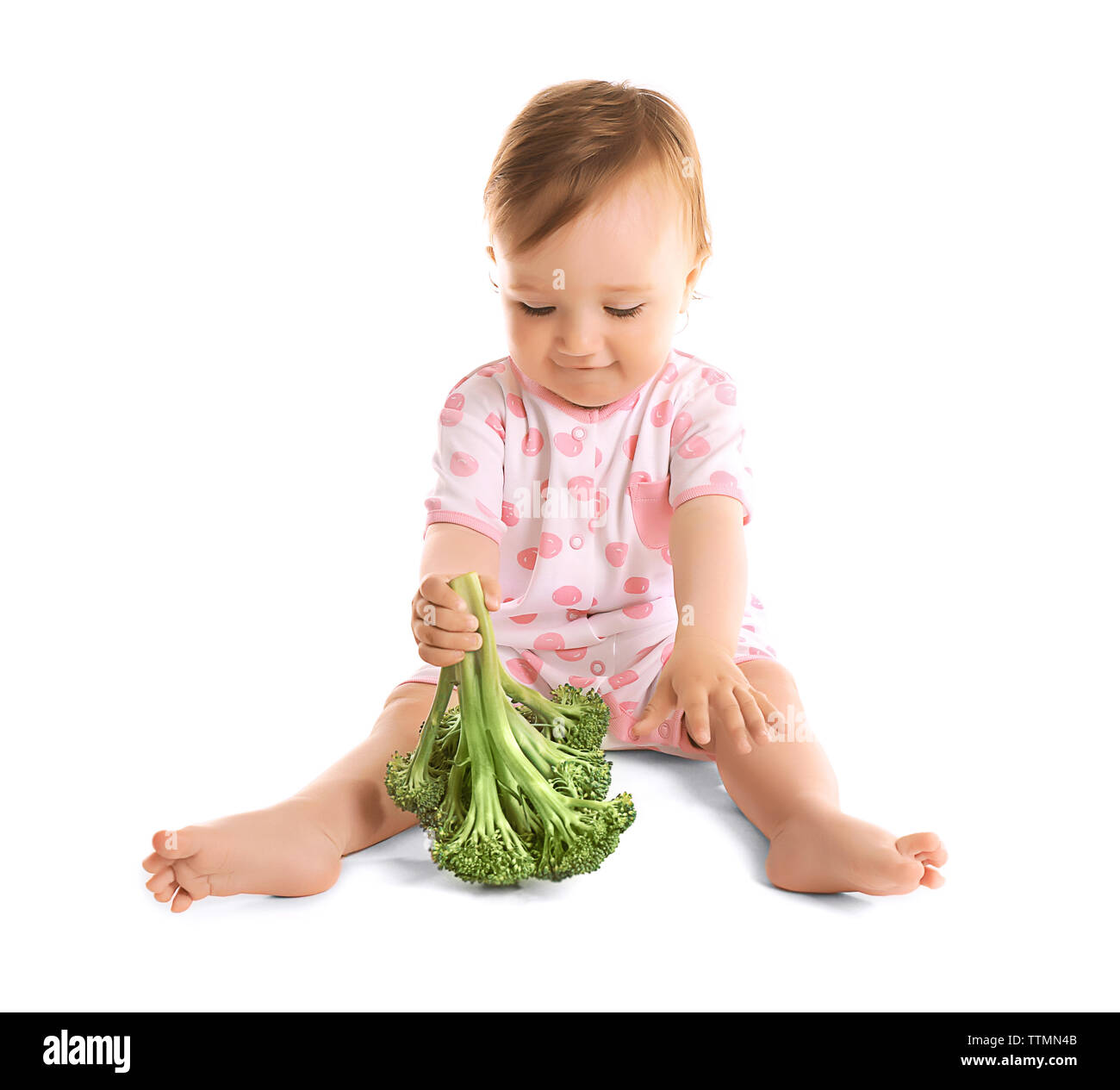 Cute baby girl with broccoli, isolated on white Stock Photo - Alamy