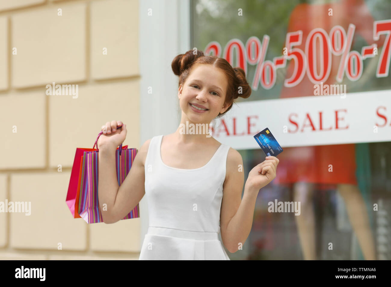 Cheerful girl walking outdoor shopping hi-res stock photography and ...