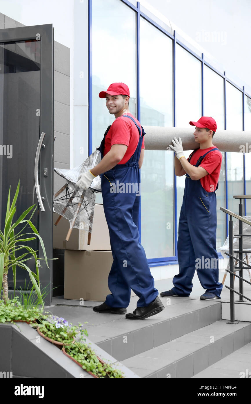 Two men carrying carpet hi-res stock photography and images - Alamy