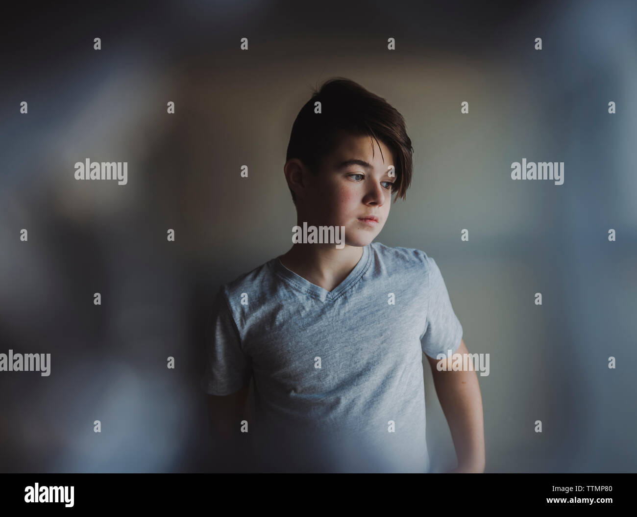 Boy standing sad hi-res stock photography and images - Alamy