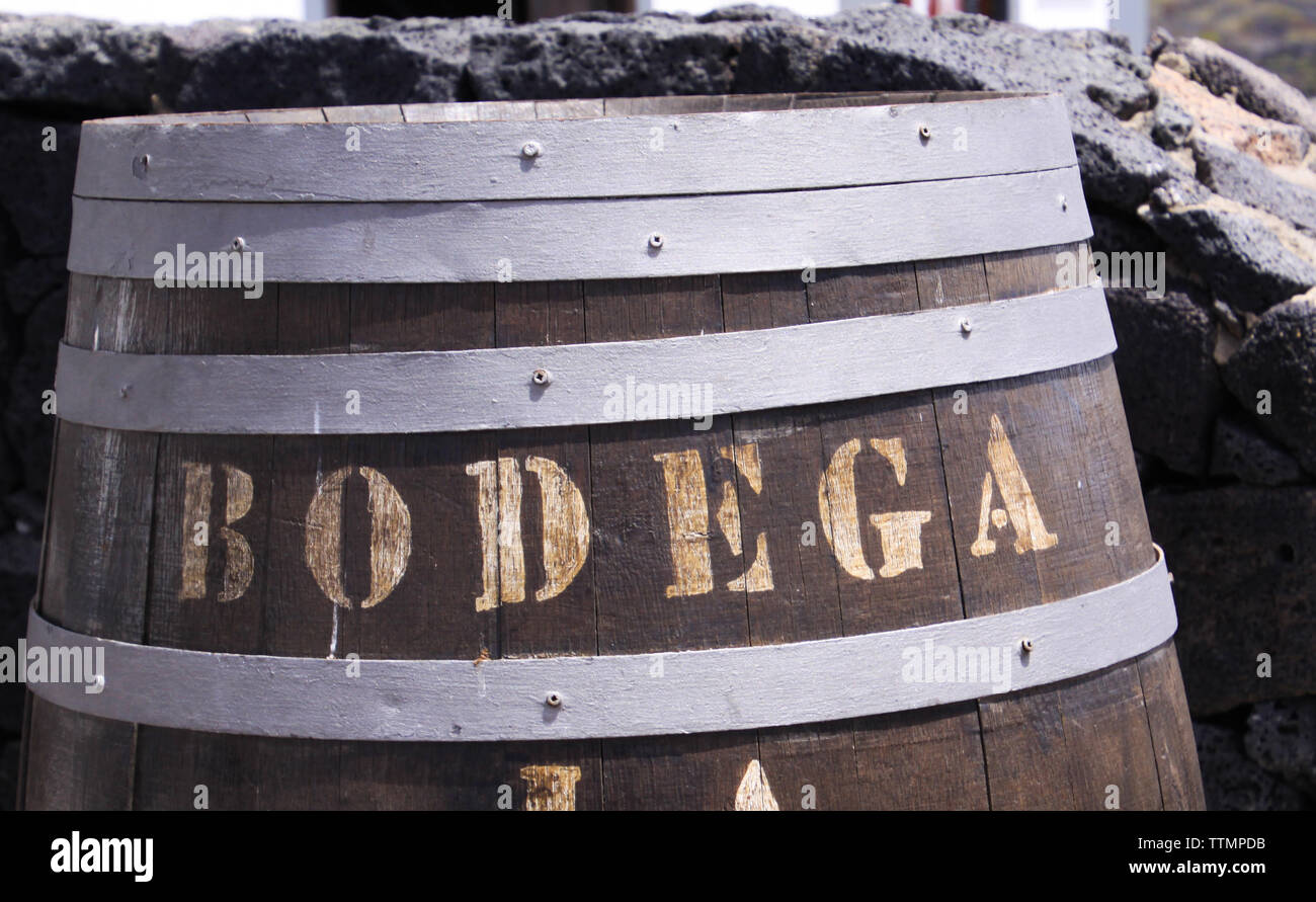 Close up of wooden wine barrel with text Bodega in front of natural ...