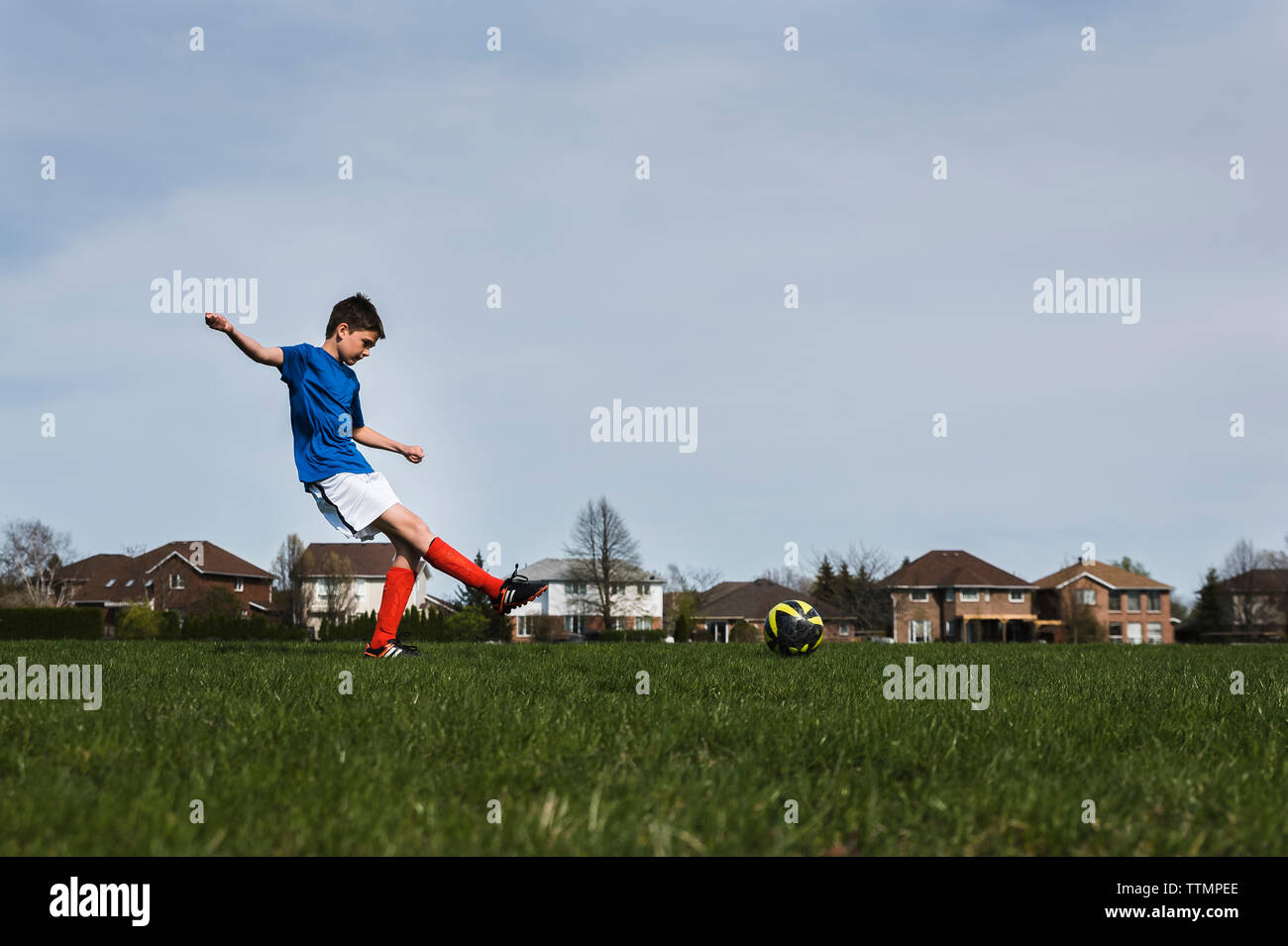 Boy playing soccer uniform hi-res stock photography and images - Alamy