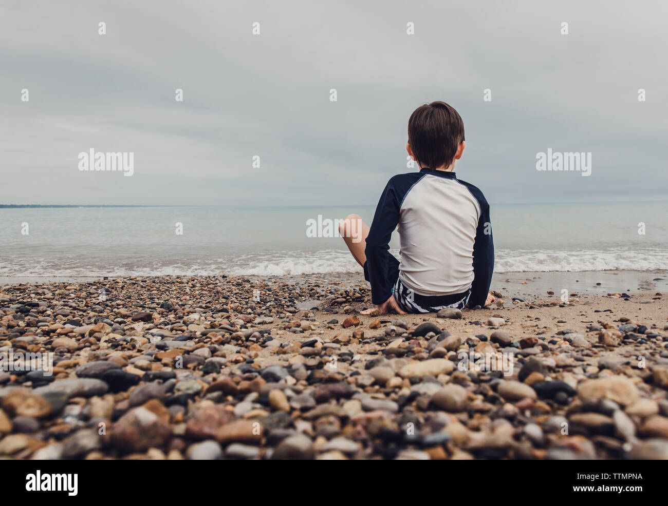 Boy rear view sitting hi-res stock photography and images - Alamy