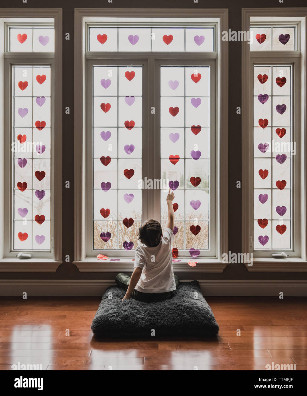 Sitting on windows hi-res stock photography and images - Alamy