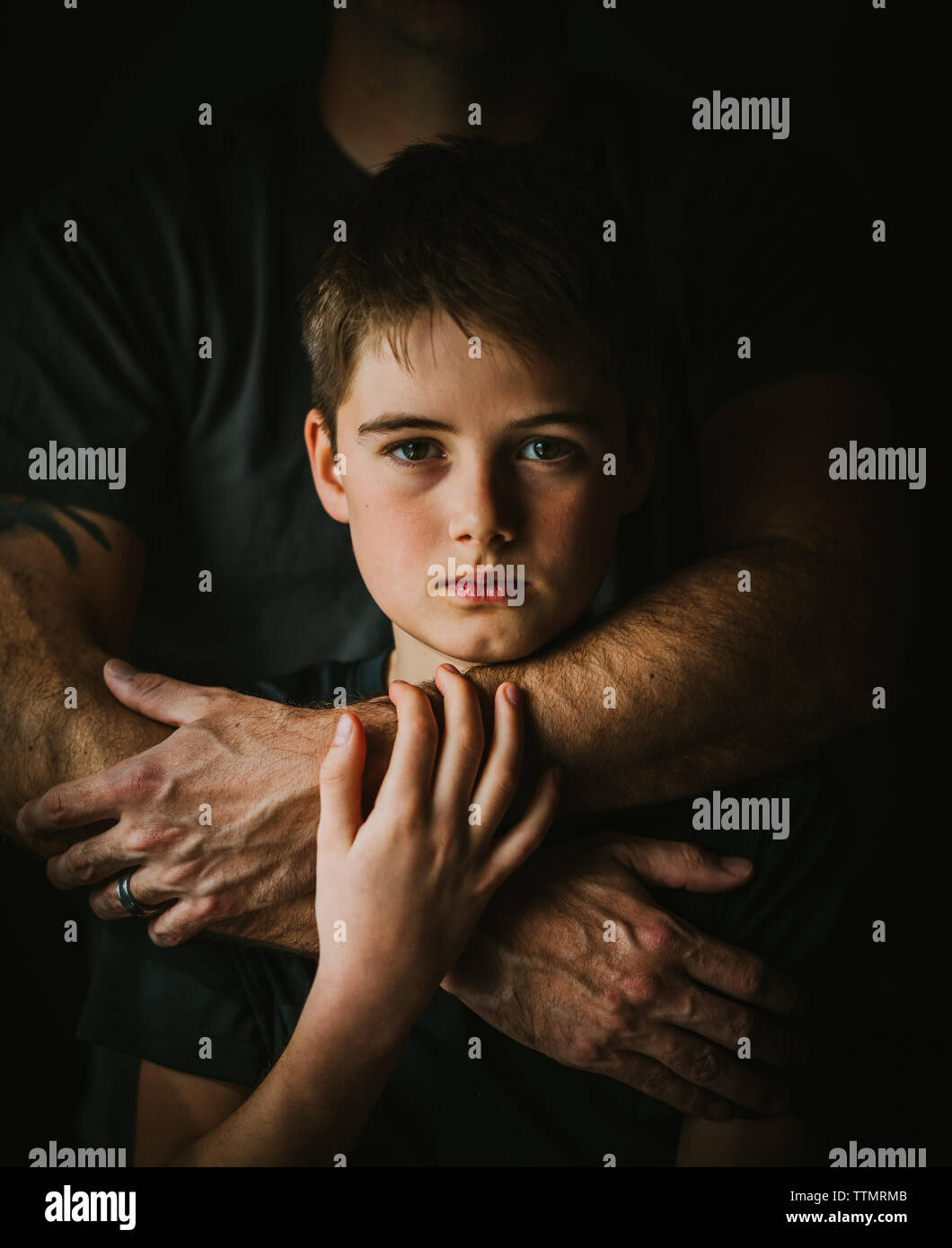 Wrapped around arms hi-res stock photography and images - Alamy