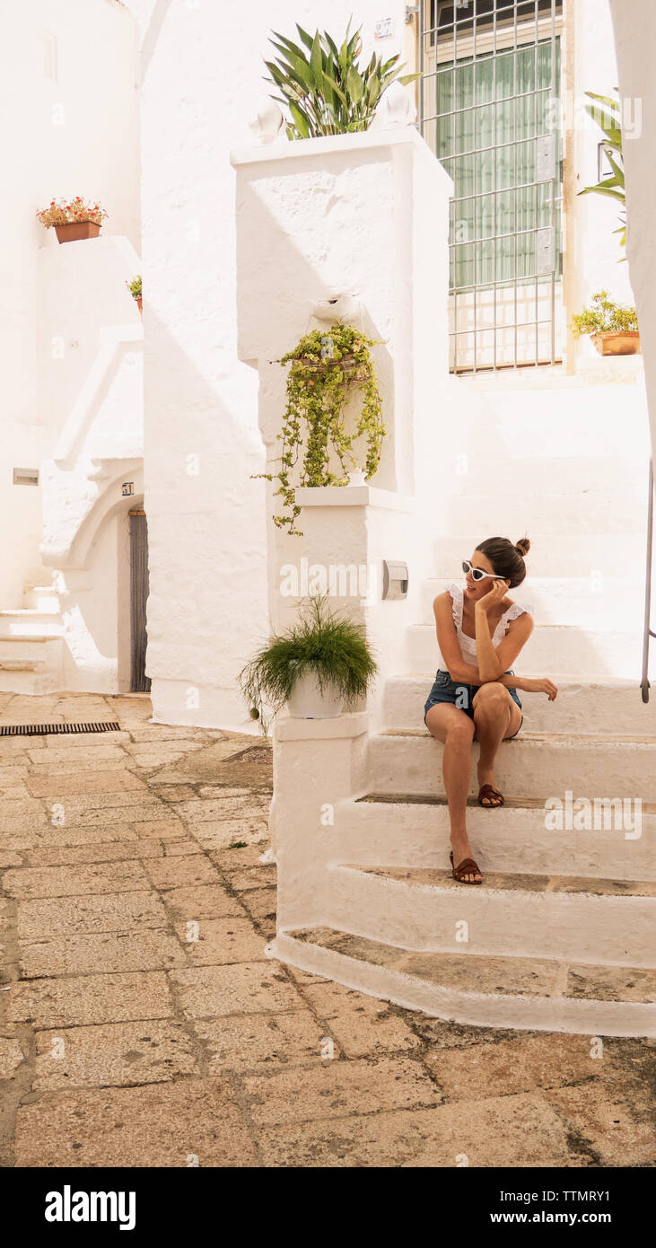 Woman on Stone Steps in Summer Stock Photo - Alamy