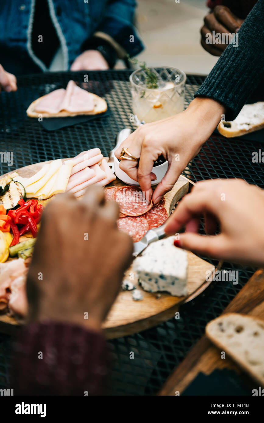 Friends dinner party cheese board hi-res stock photography and images ...