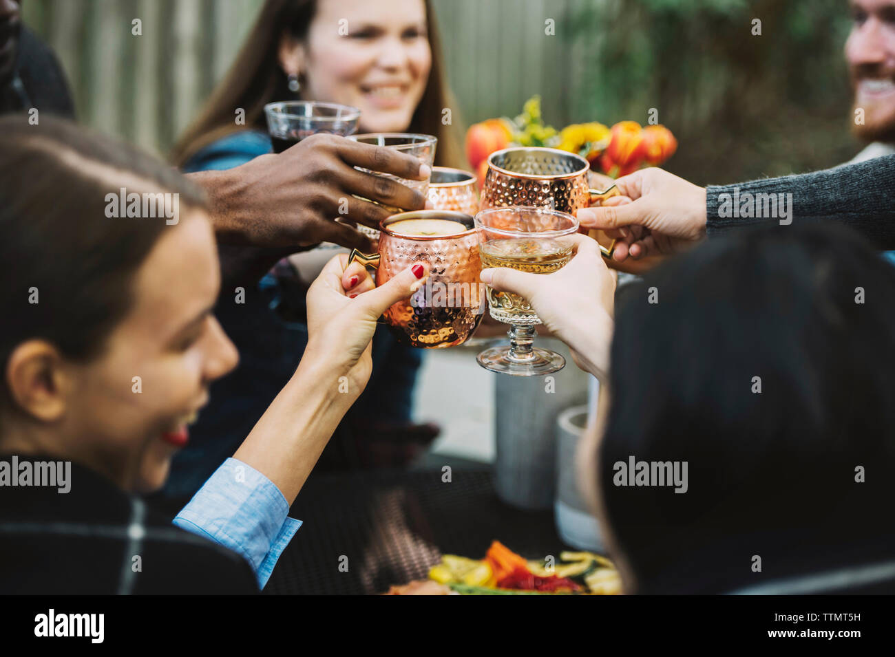 Women friends toasting drinks drinking smiling hi-res stock photography ...
