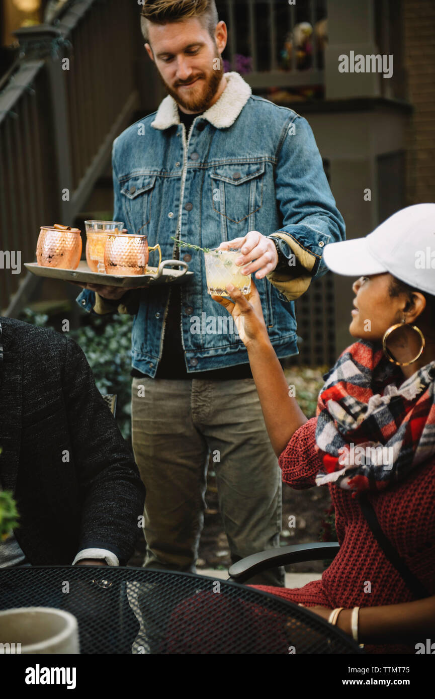 Man serving drinks hi-res stock photography and images - Alamy