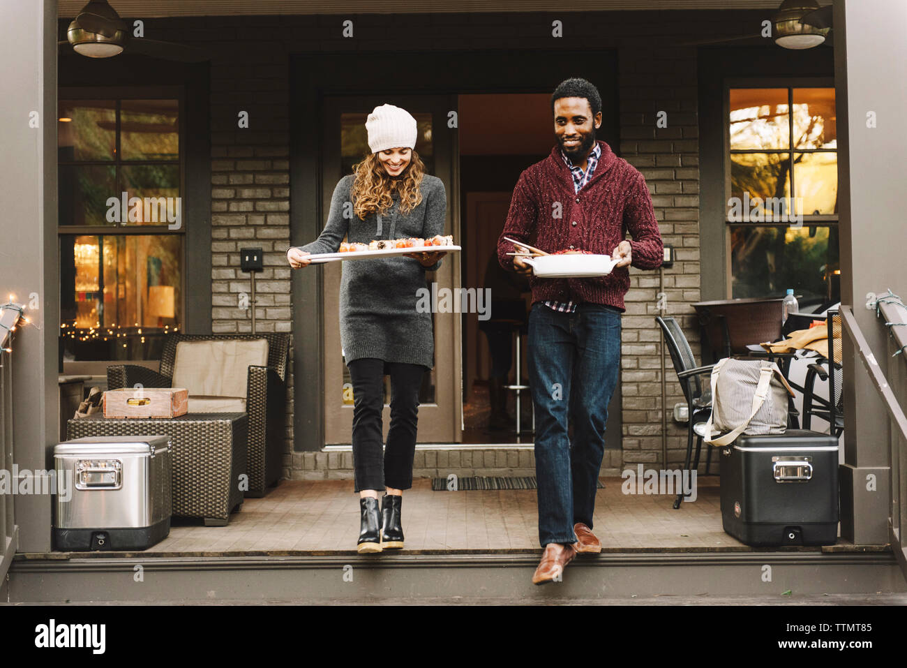 Young woman carrying tray hi-res stock photography and images - Alamy