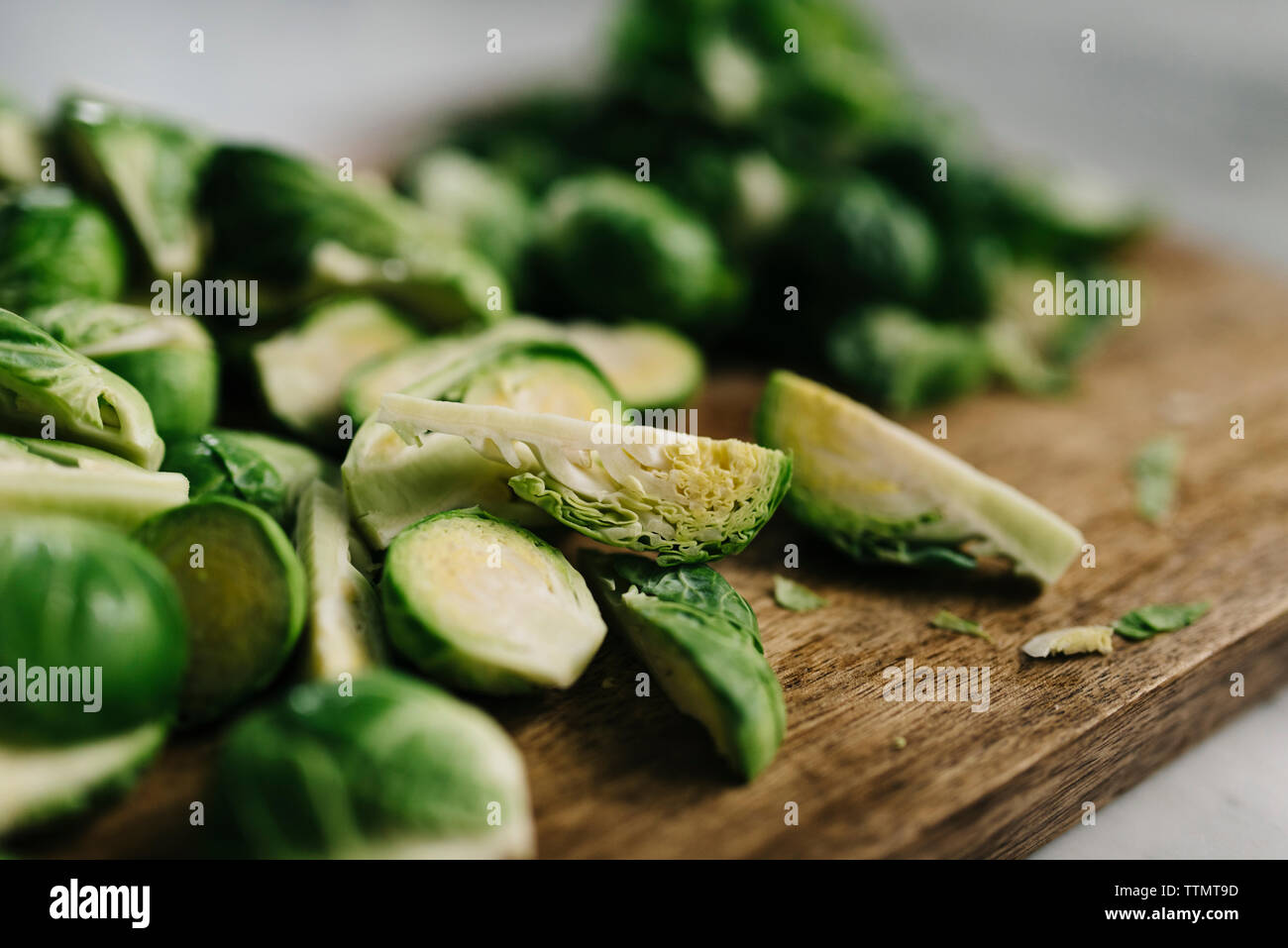 Close-up of chopped Brussels sprouts on cutting board Stock Photo - Alamy