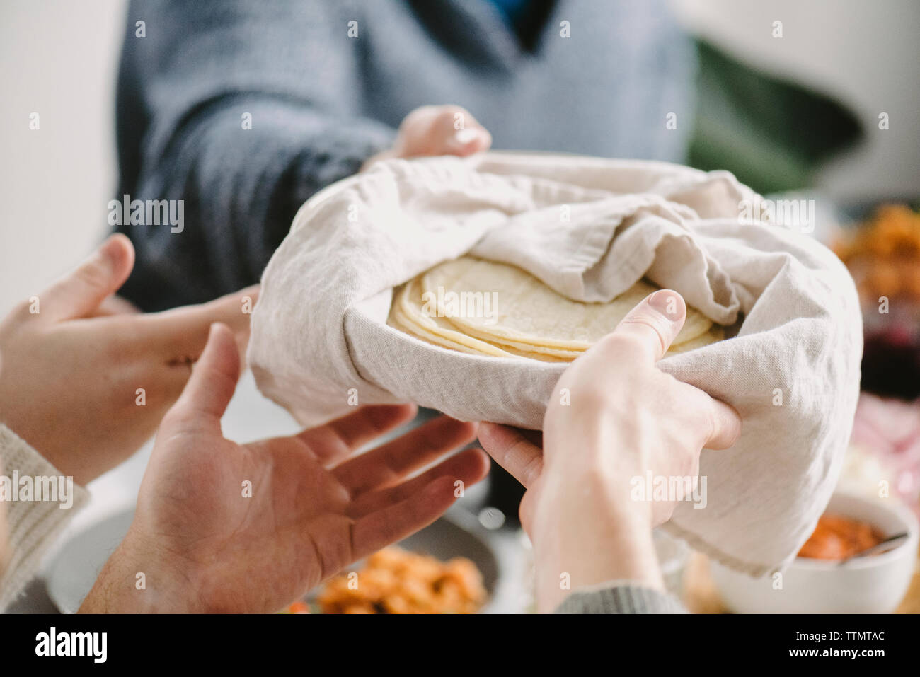 Woman passing plate food table hi-res stock photography and images - Alamy