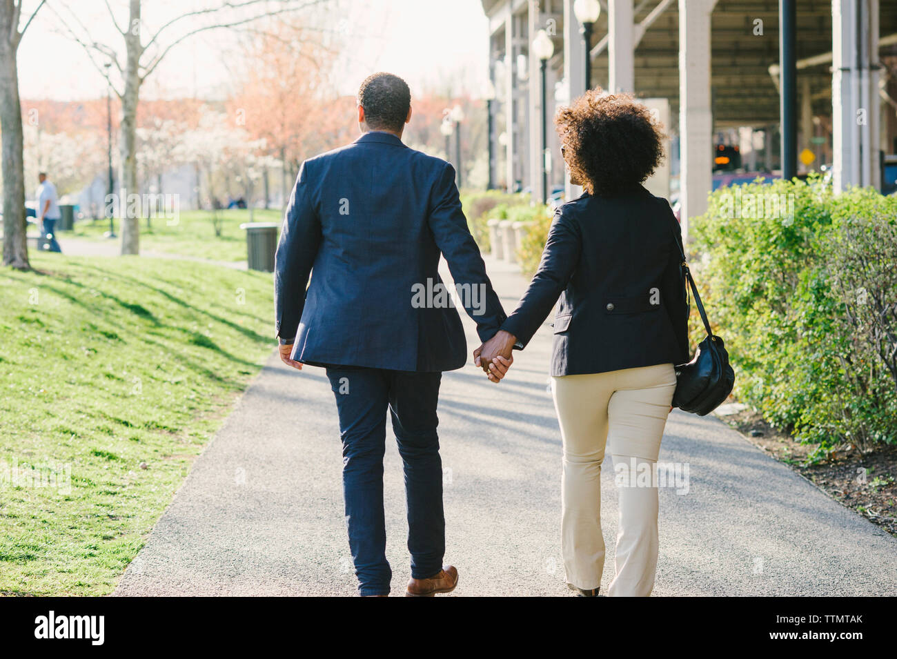 Couple park walking rear view hi-res stock photography and images - Alamy