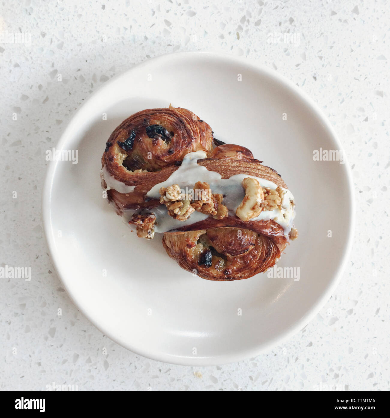 Sweet bun on plate Stock Photo - Alamy