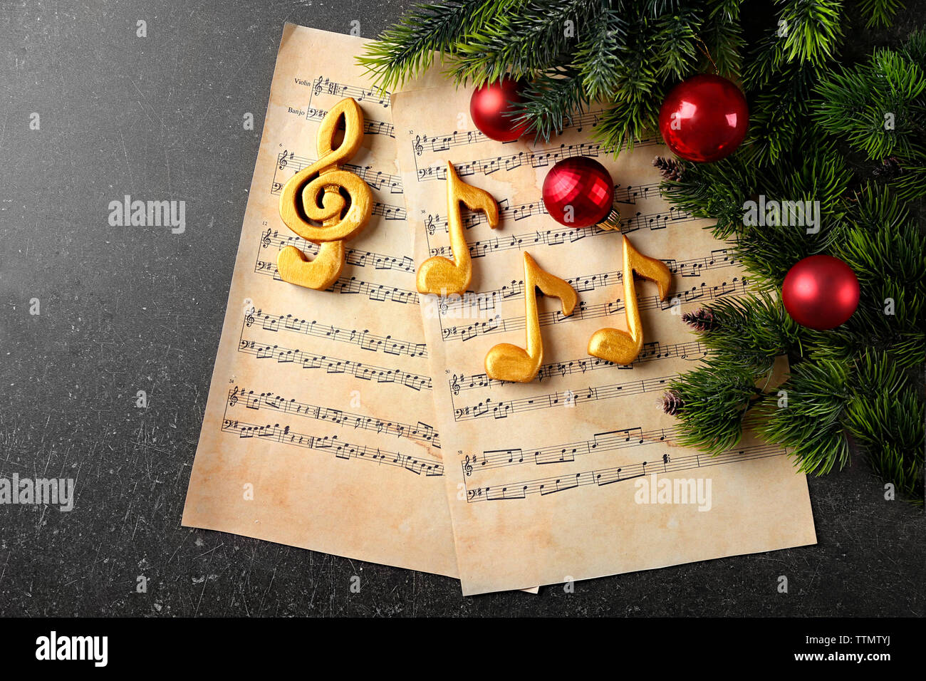 Christmas decorations on music sheets Stock Photo - Alamy