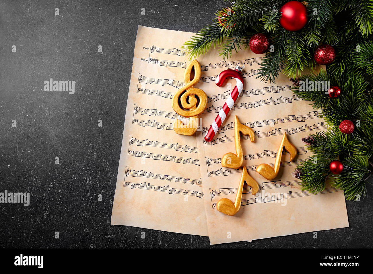 Christmas decorations on music sheets Stock Photo - Alamy