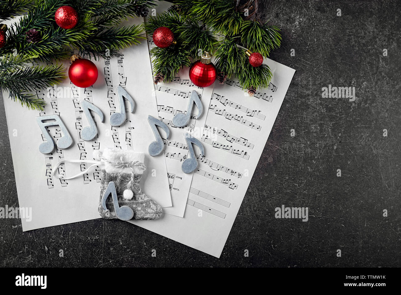 Christmas decorations on music sheets Stock Photo - Alamy