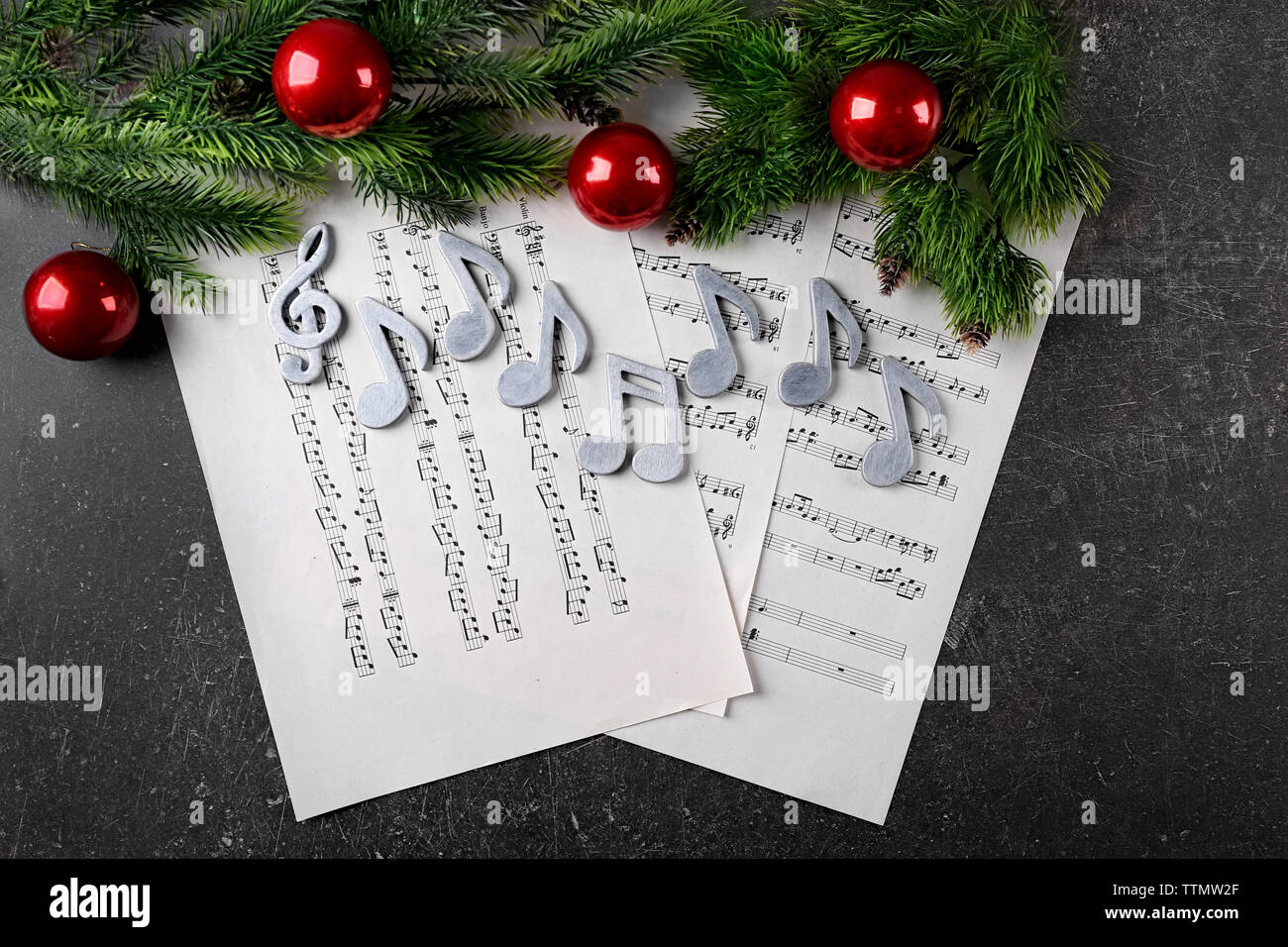 Christmas decorations on music sheets Stock Photo - Alamy