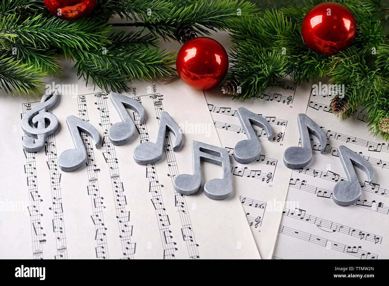 Christmas decorations on music sheets Stock Photo - Alamy