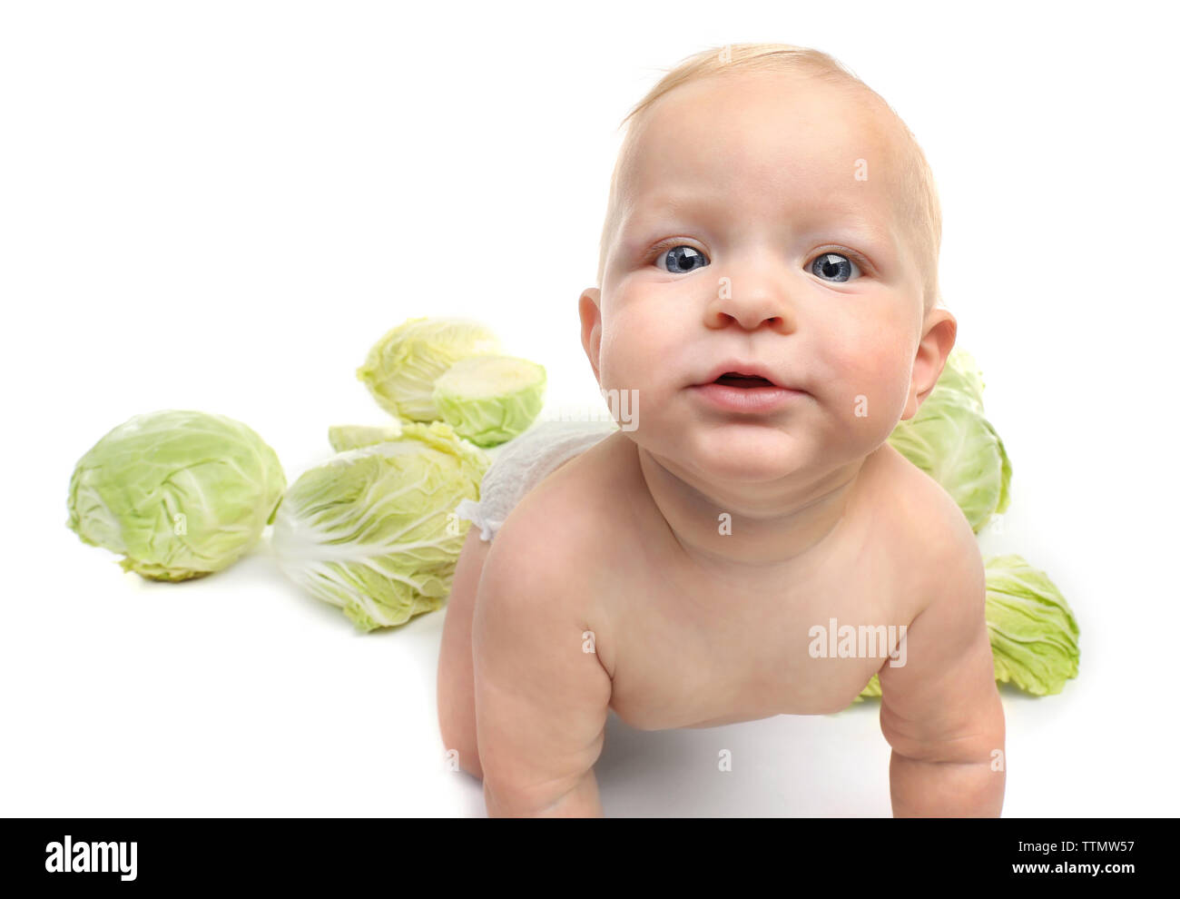 Beautiful baby and green cabbage on white background Stock Photo - Alamy