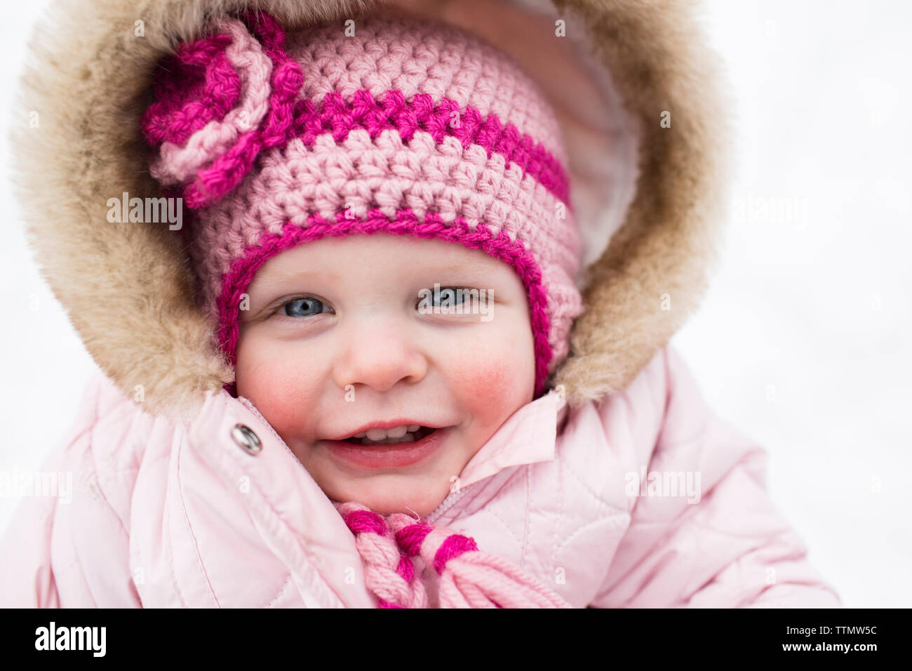 Portrait of cute smiling girl in warm clothing Stock Photo - Alamy