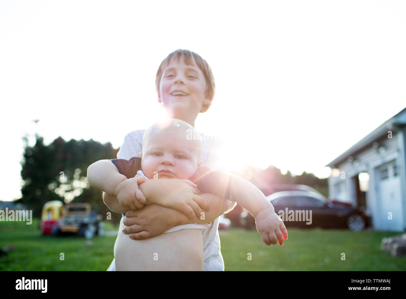 Portrait two brothers standing back hi-res stock photography and images ...