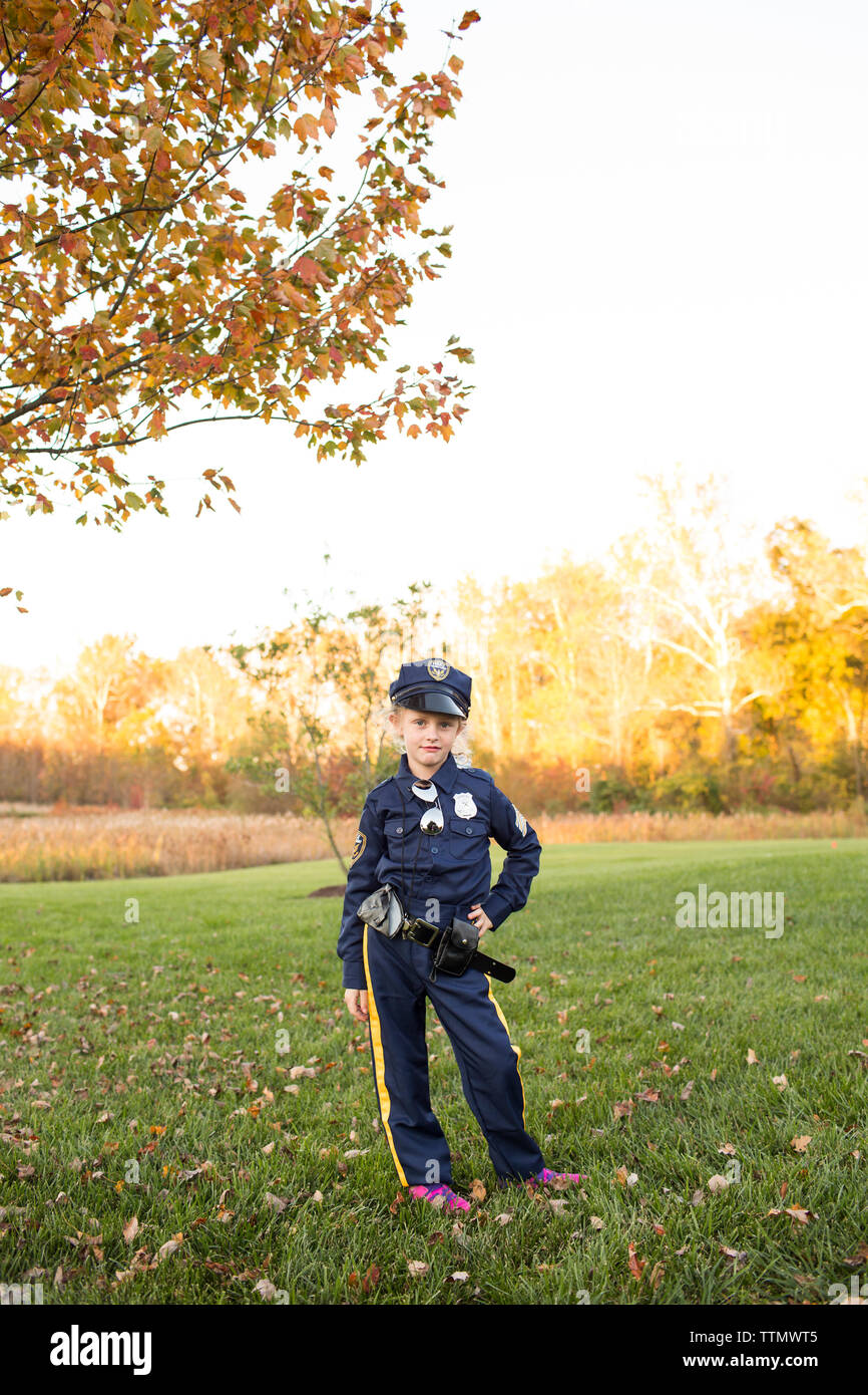 Cute Blonde Curly Hair Girl Poses in Police Officer Halloween Costume ...