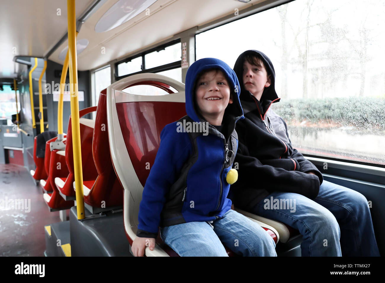 Tween and Younger Brother Sit on Bottom Level of Double Decker Bus ...