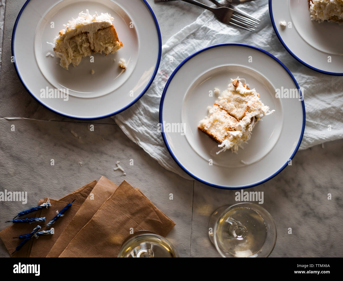 High angle view of cake slices in plates on table Stock Photo - Alamy