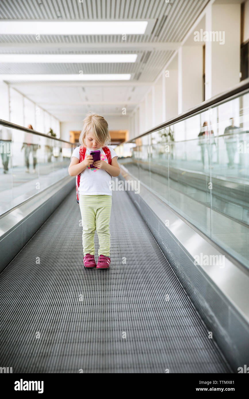 Moving walkway girl hi-res stock photography and images - Alamy