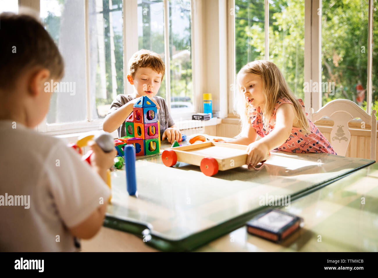 Playing together blocks hi-res stock photography and images - Alamy