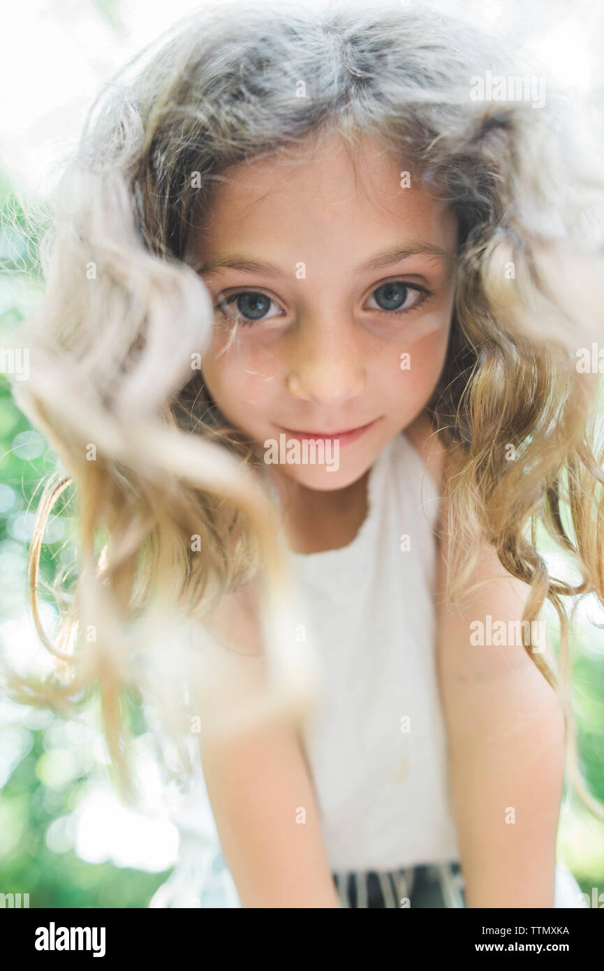 Low angle portrait of confident girl at park Stock Photo - Alamy