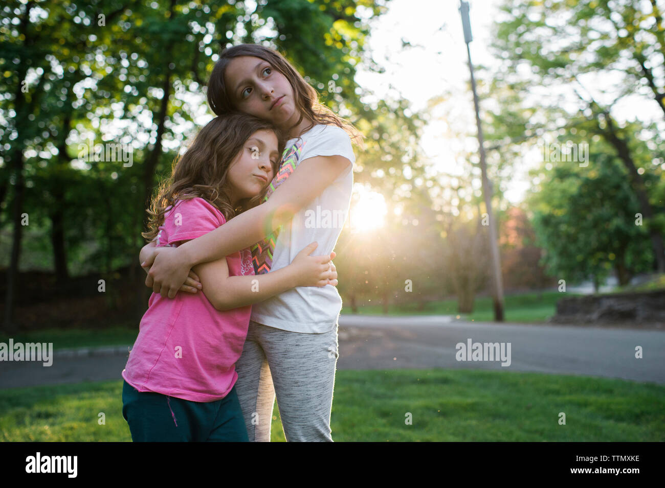 Sisters embracing hi-res stock photography and images - Alamy