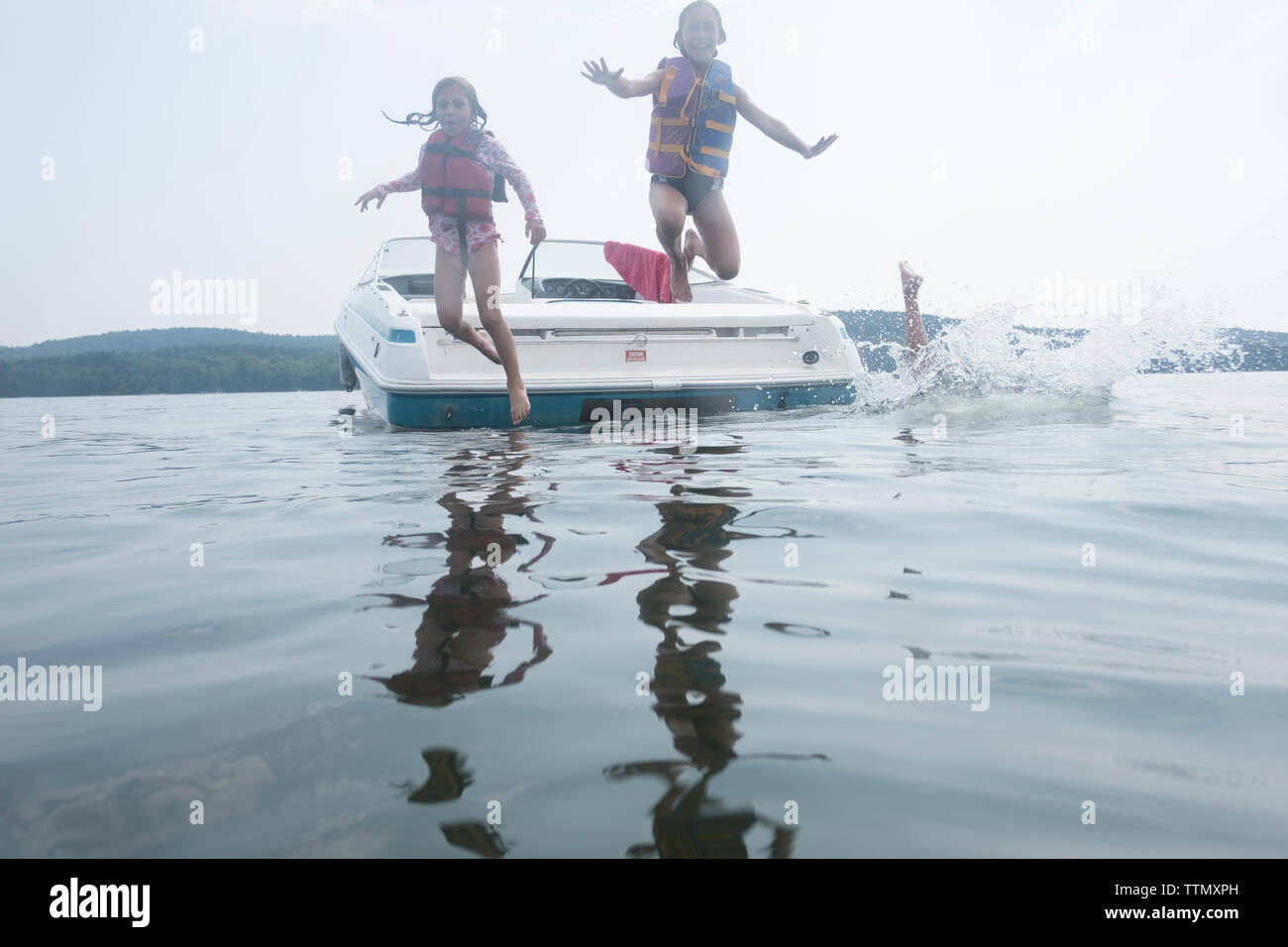 Happy jumping family hi-res stock photography and images - Alamy