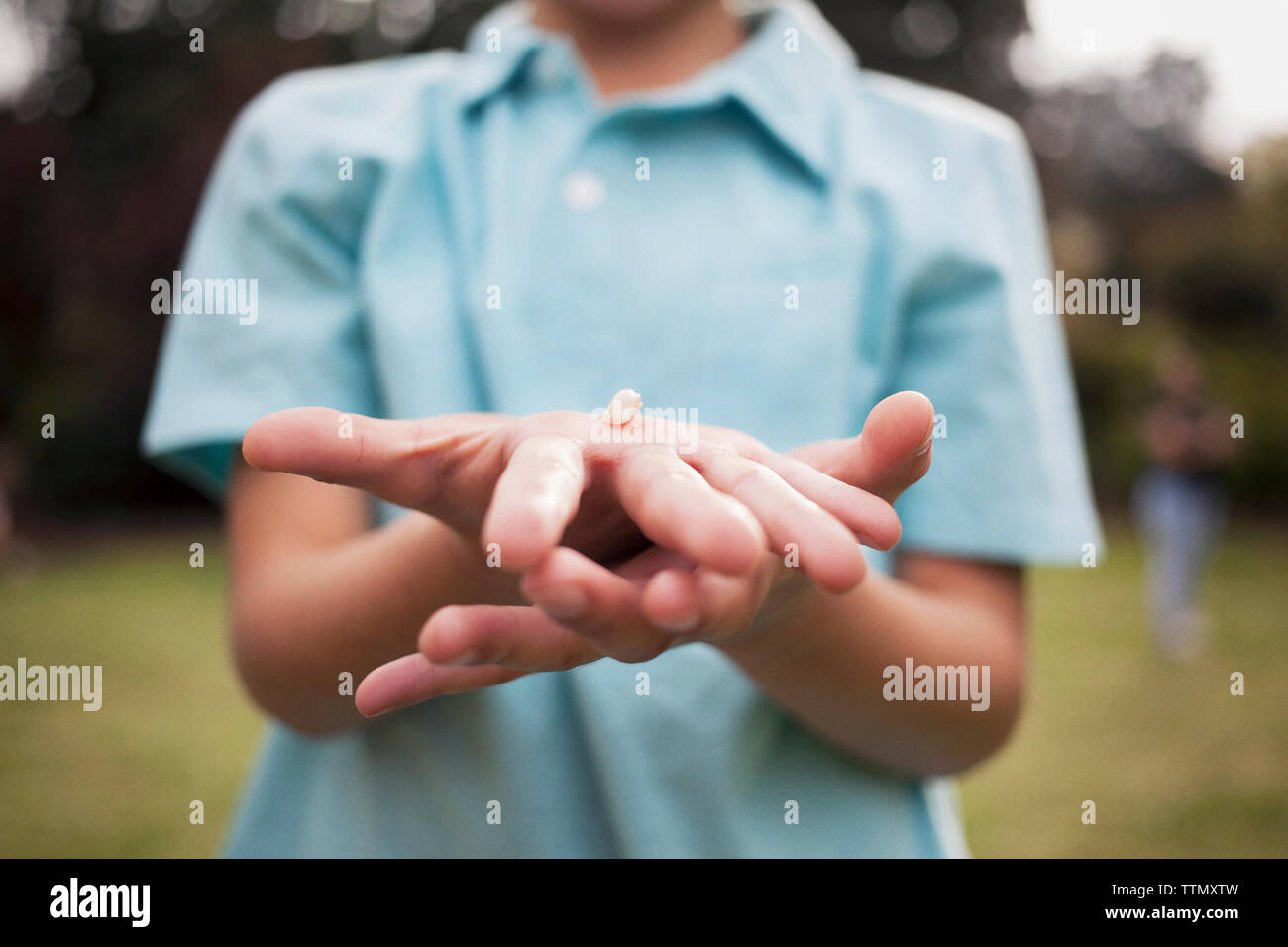 Small hand showing stone hi-res stock photography and images - Alamy