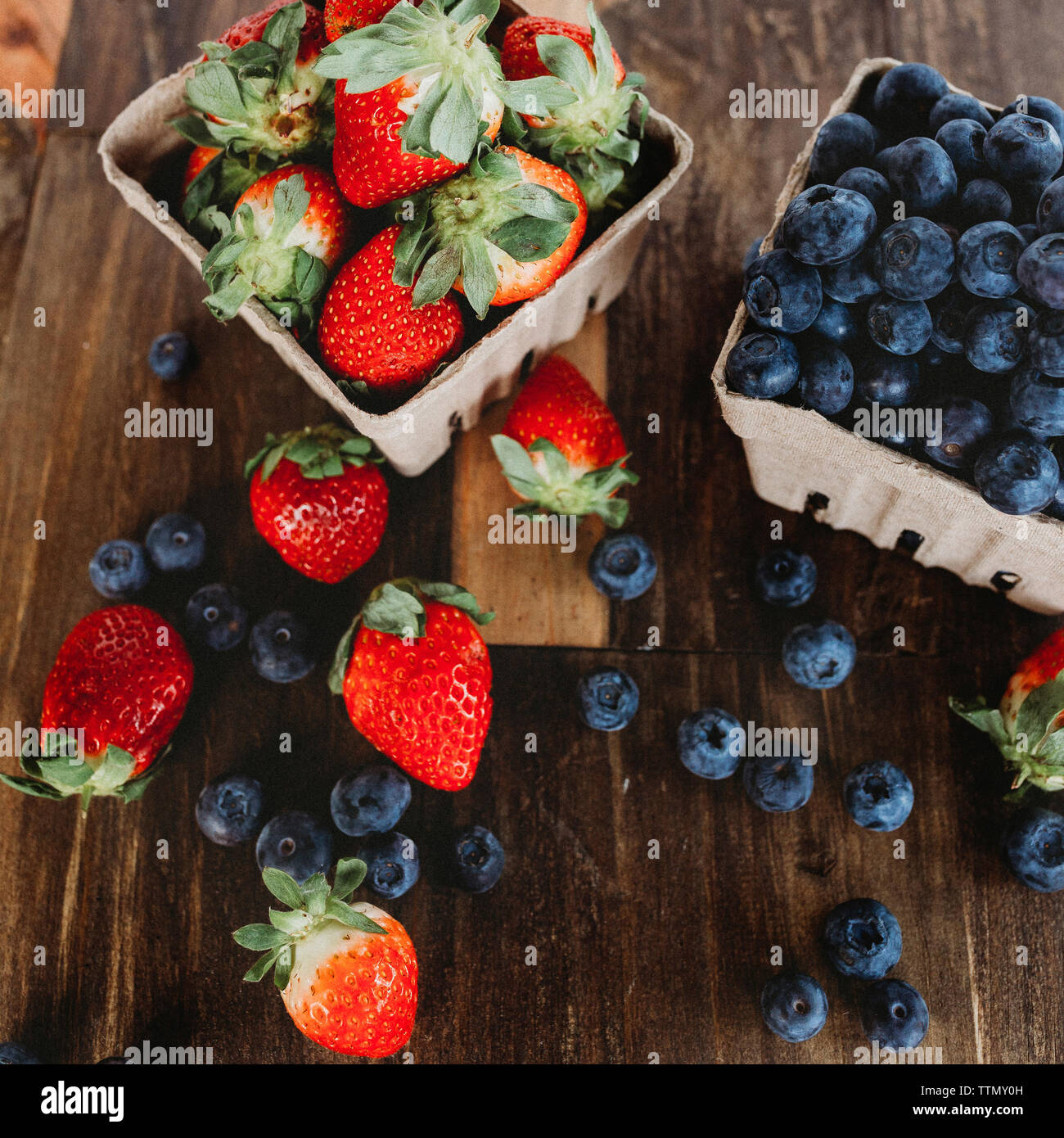 Strawberries blueberries in wooden hi-res stock photography and images ...