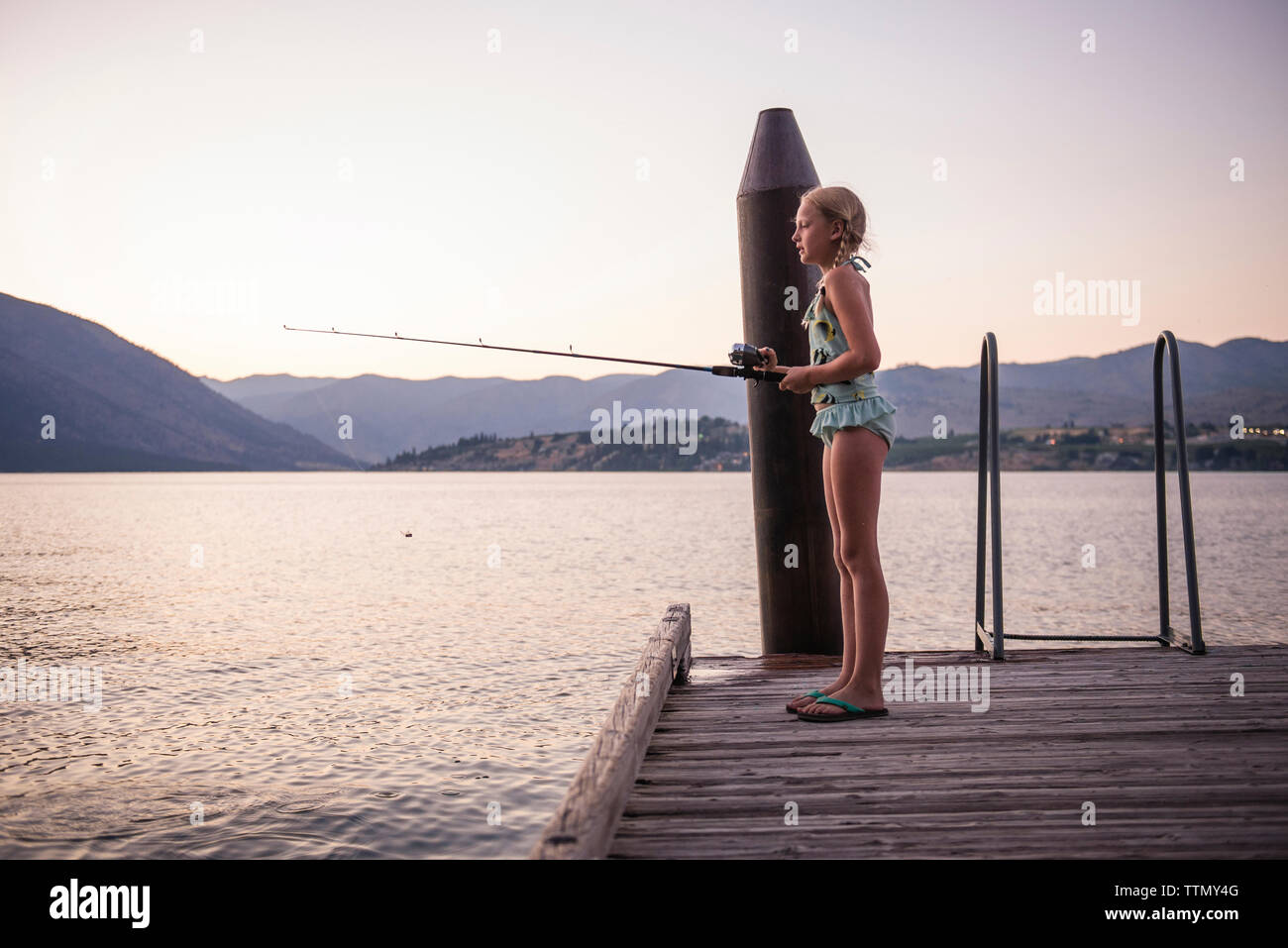 Girl fishing hi-res stock photography and images - Alamy