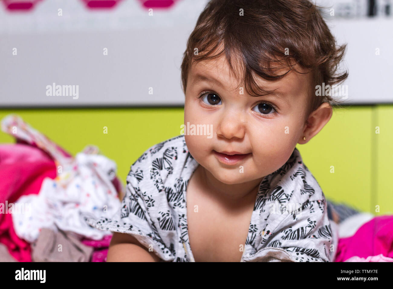 messy girl clothes on top of her mother's bed Stock Photo - Alamy