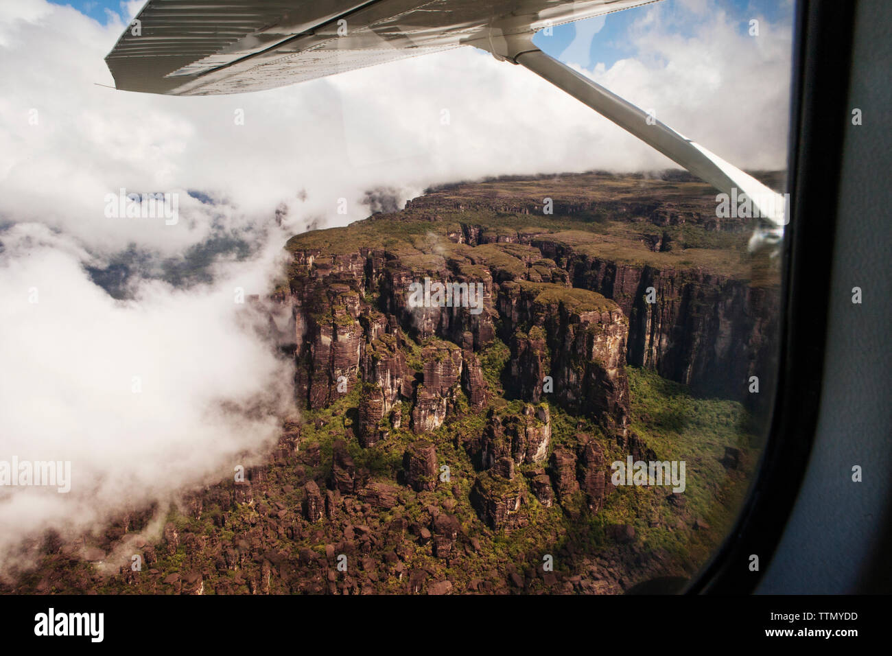 Flying through clouds in mountains hi-res stock photography and images ...