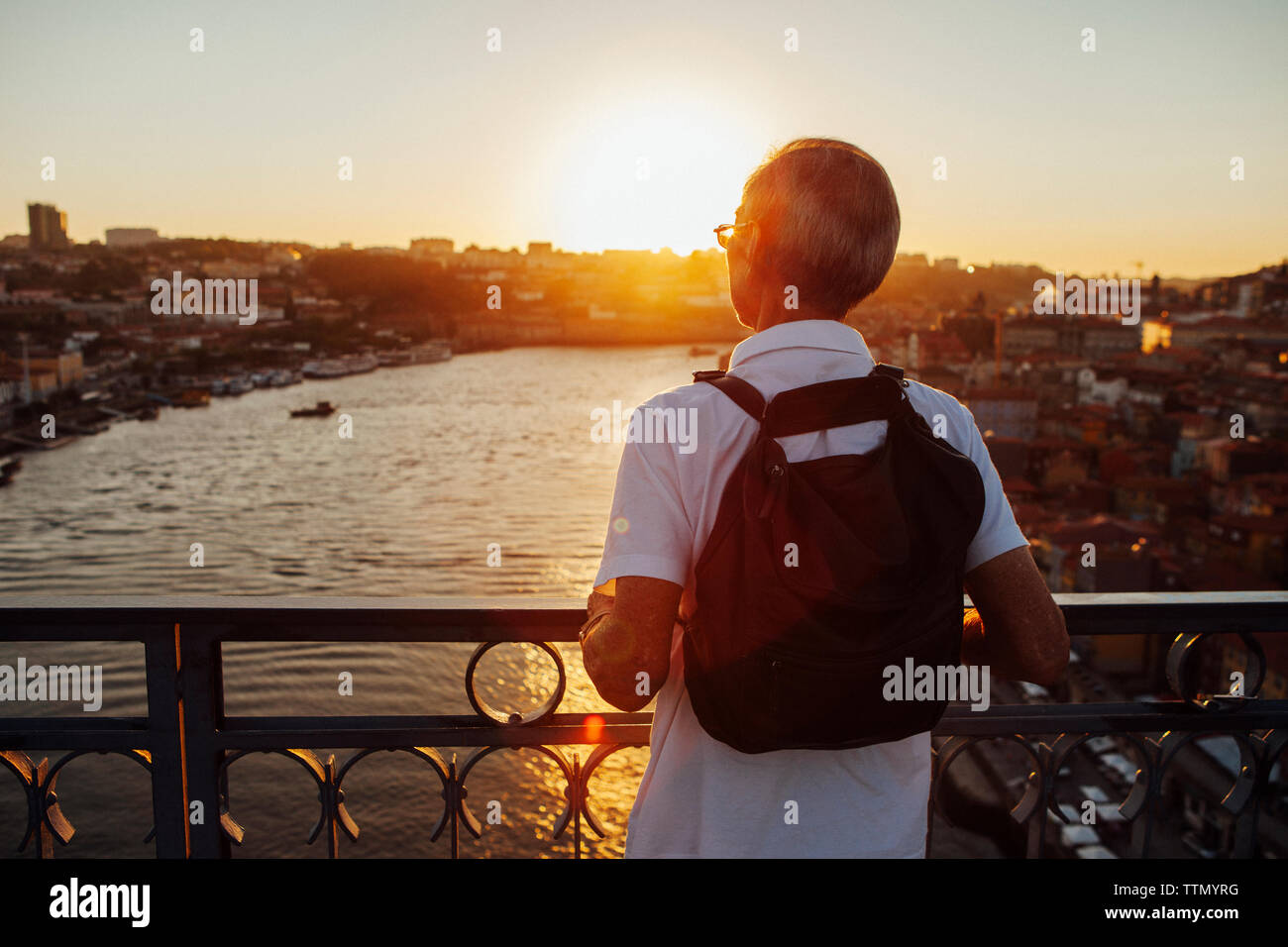 Man standing bridge sunset hi-res stock photography and images - Alamy