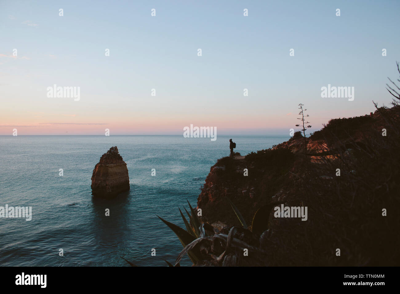 Mid distance silhouette man standing hi-res stock photography and ...