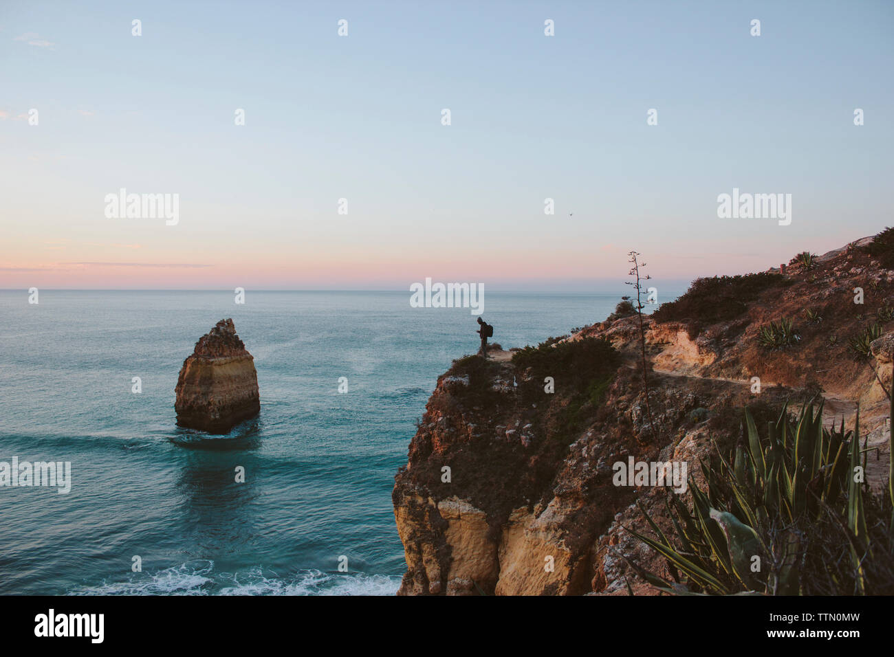 Mid distance silhouette man standing hi-res stock photography and ...